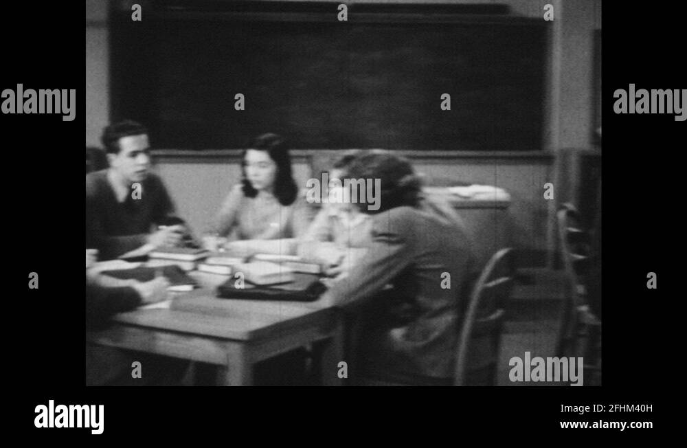 1940s: Classroom. Students sit in group and talk Stock Video Footage ...