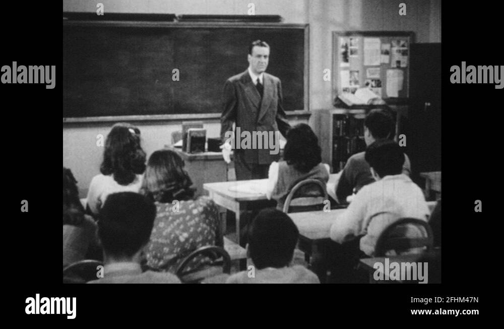 1940s: Students sit in classroom. Teacher stands and speaks Stock Video ...