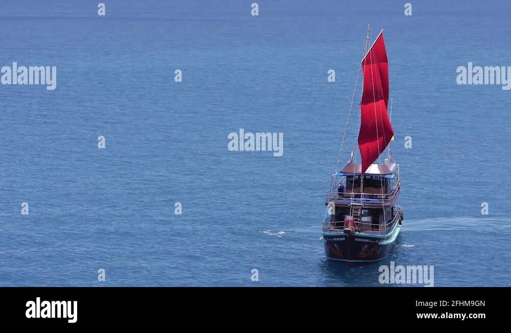 Boat with red sail Stock Videos & Footage - HD and 4K Video Clips - Alamy
