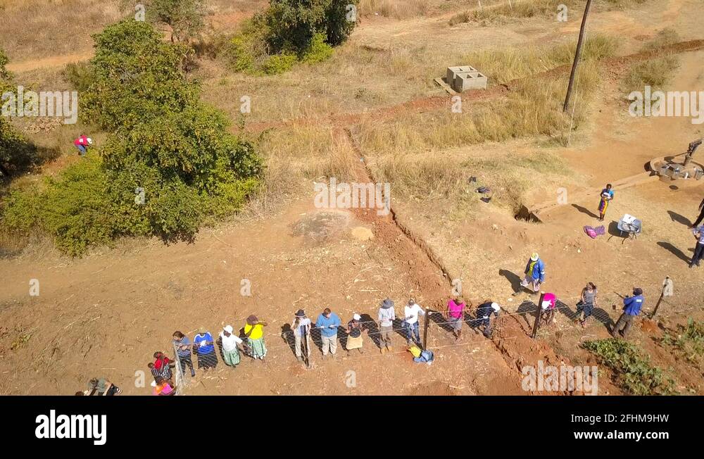 Using Teamwork to Build a Fence Around a Garden in Rural Zimbabwe ...