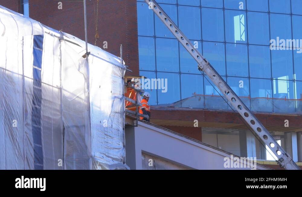 Crane lifting construction material Stock Videos & Footage - HD and 4K ...