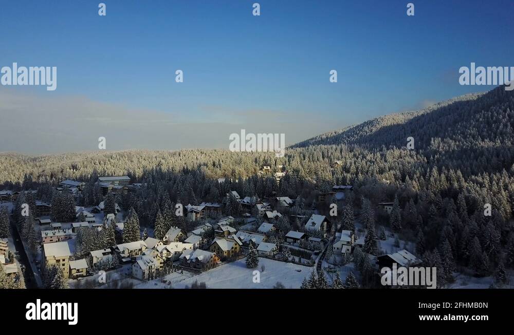 Beautiful village covered in snow. The snow shining in the daylight ...