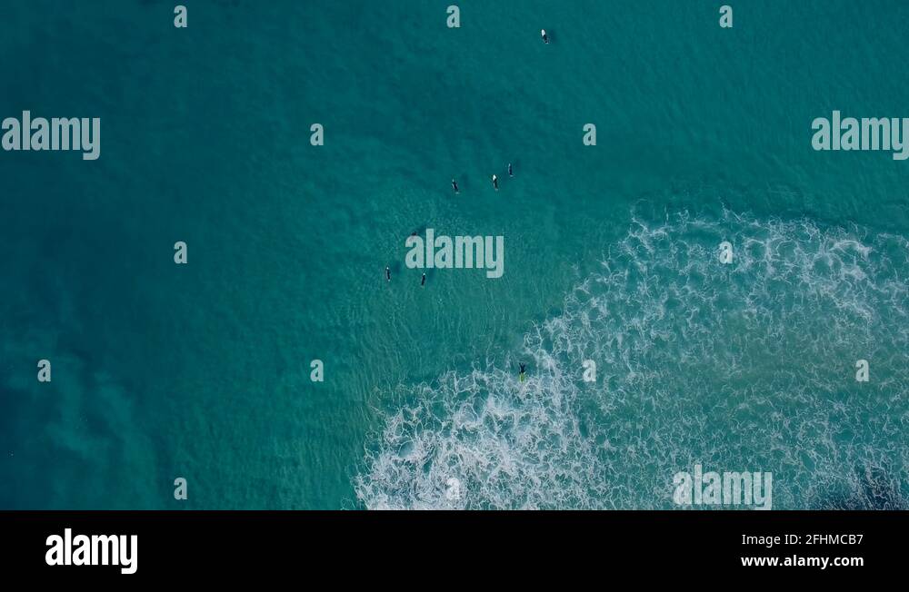 4k Drone footage of surfers at a beautiful Australian coastal beach ...