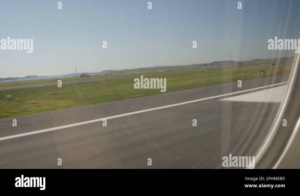 Airplane gaining speed and taking off from Boston Logan International ...