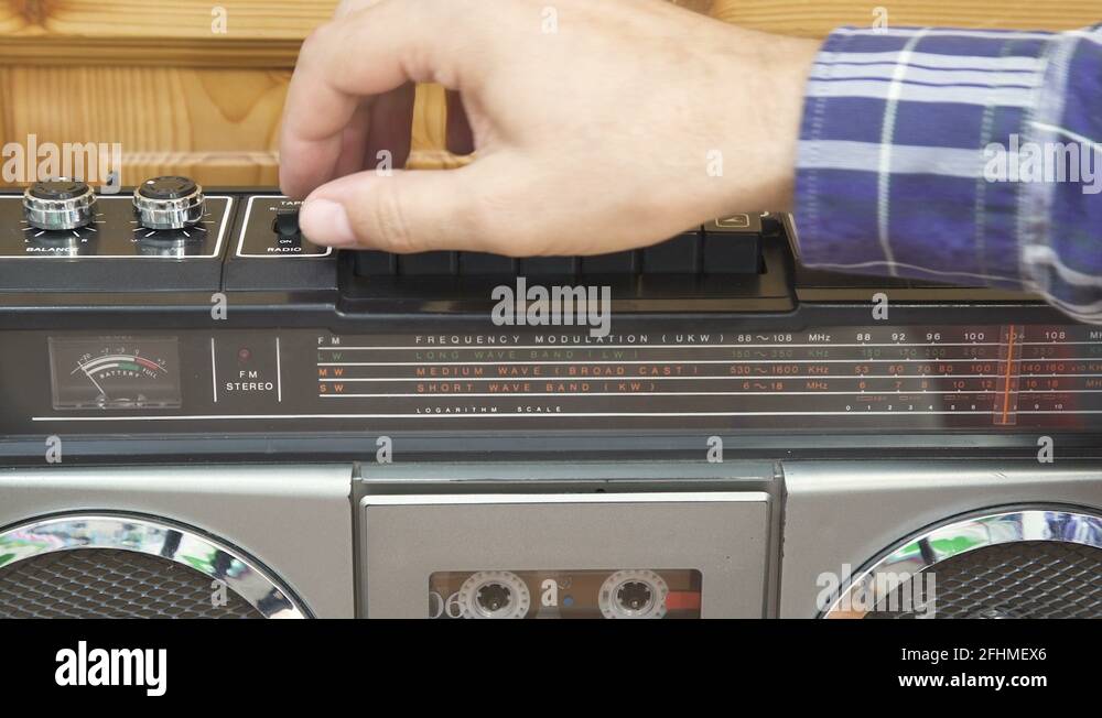 Pushing Play Button On The Vintage Audio Cassette Player. Tuning Radio ...