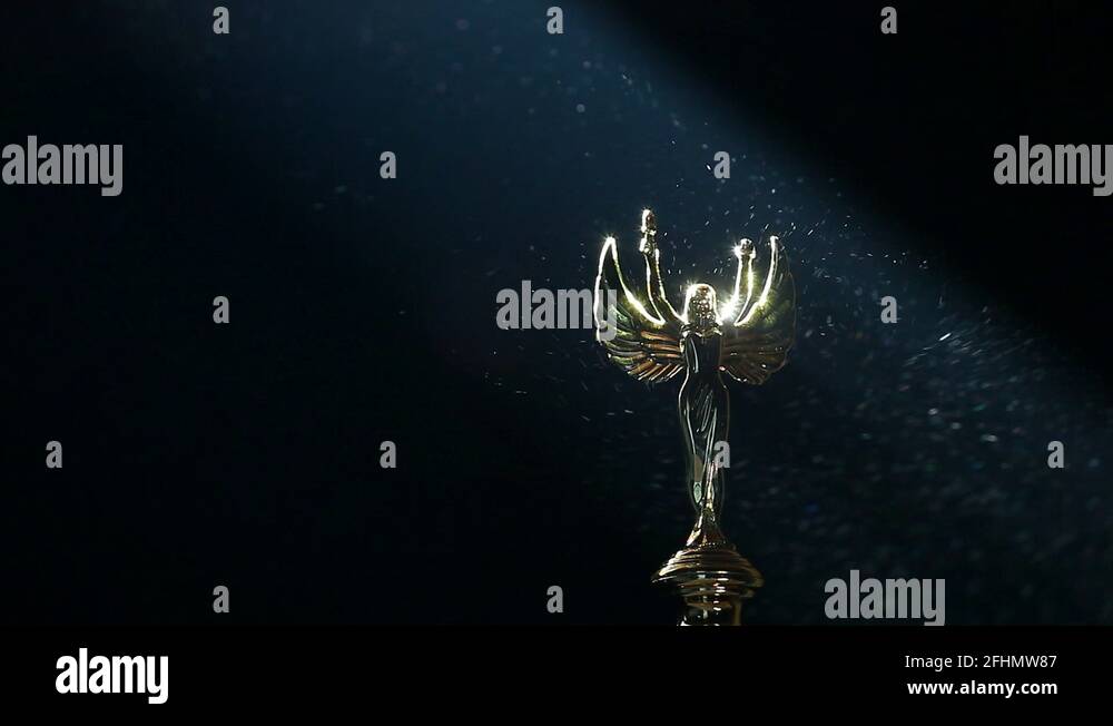 Gold Woman Statue dark background Stock Video Footage - Alamy