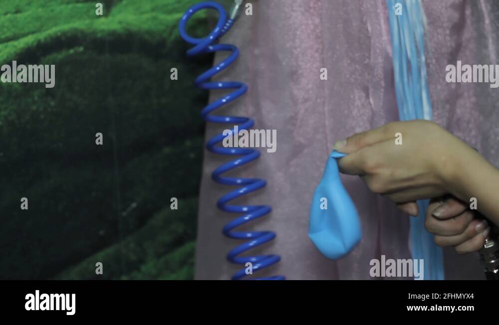Working process of inflating a balloon with gas helium from a metal gas ...