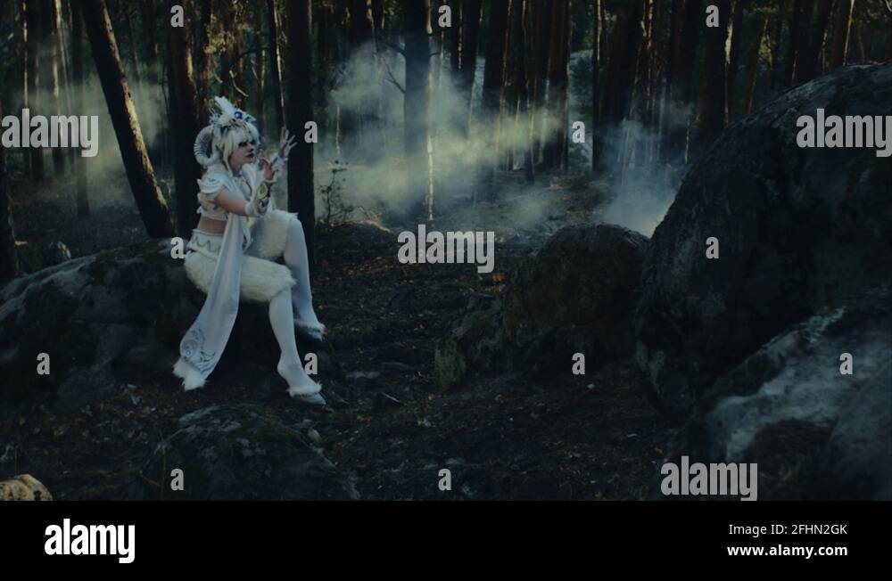 Fictional forest creature satyr with horse-like legs is sitting in ...