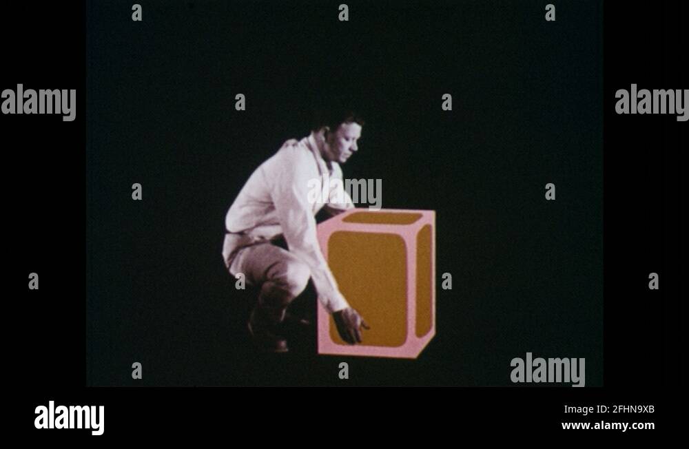 1960s: Animated man squats and lifts box Stock Video Footage - Alamy