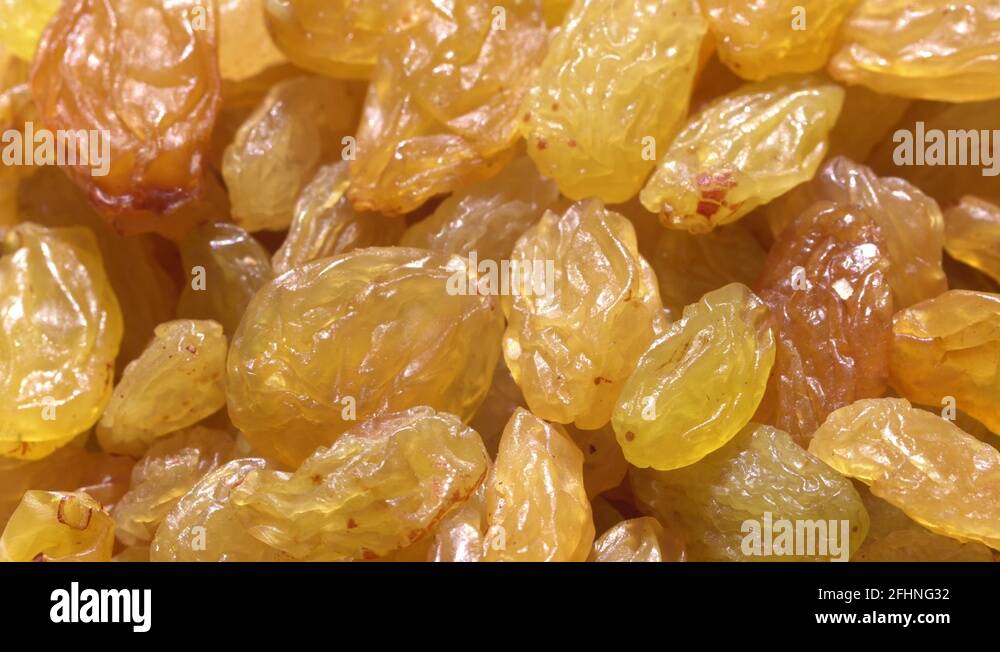 Light raisin largely. Healthy food. Dried fruits. Movement in a circle ...