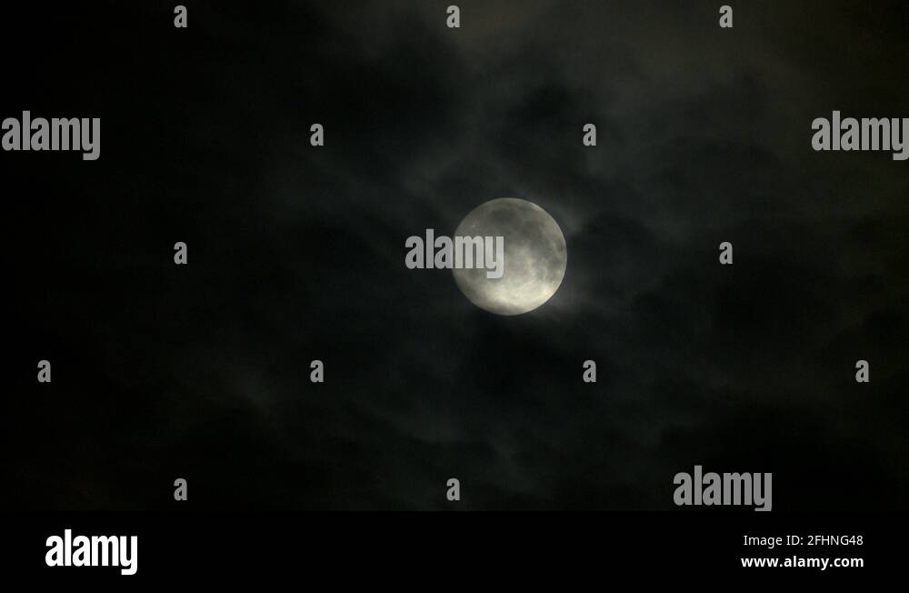 Bright full moon illuminates the forest fire smoke hanging in the sky ...