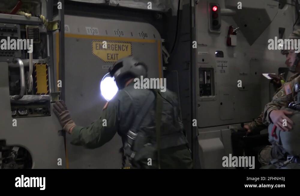 Pilot prepares to open the aircraft door for static line jump - 2016 ...