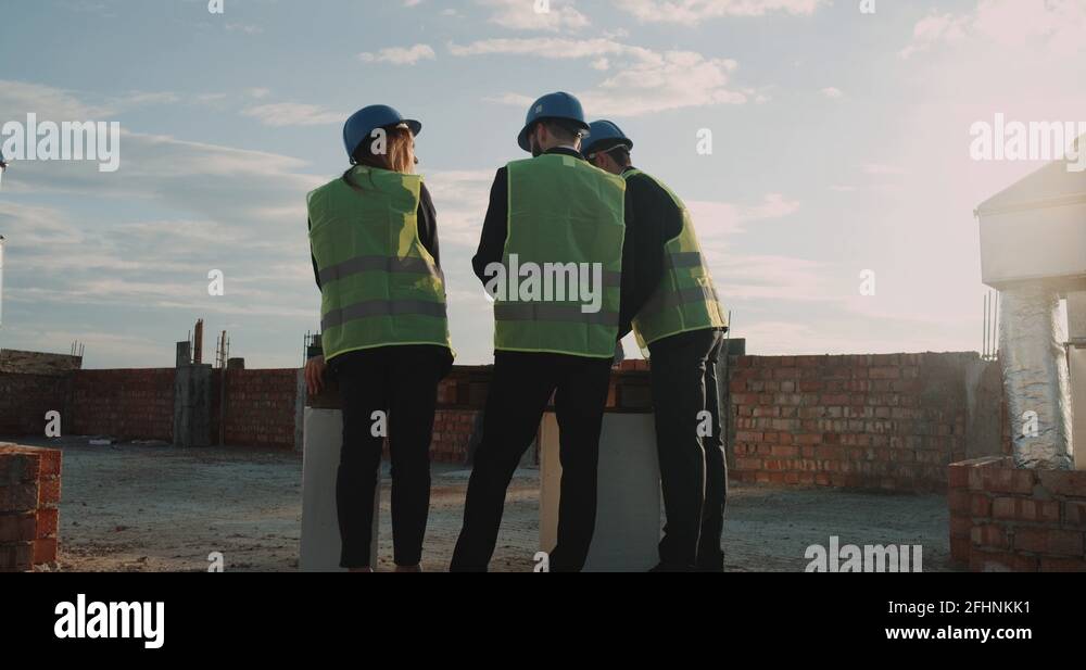 Workteam engineers analyzing the scheme map of building on construction ...
