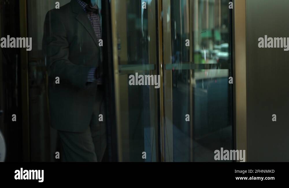 People walking through glass door Stock Videos & Footage - HD and 4K ...