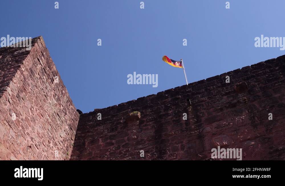 German flag waving seen from bottom exterior of old castle wall 4k ...