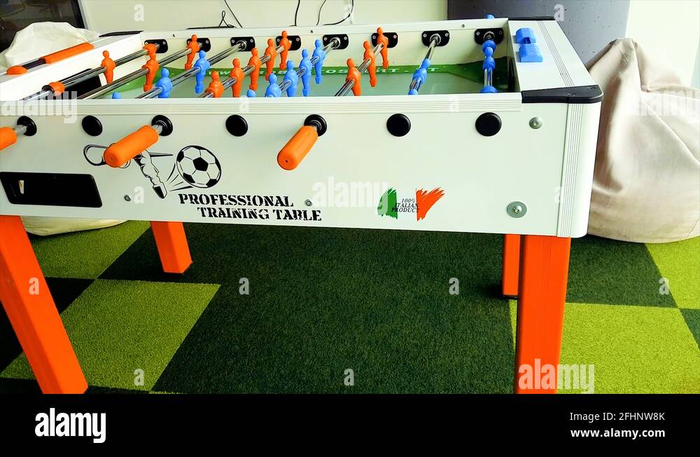 Shot of a football table in a relax room for programmers with two ...