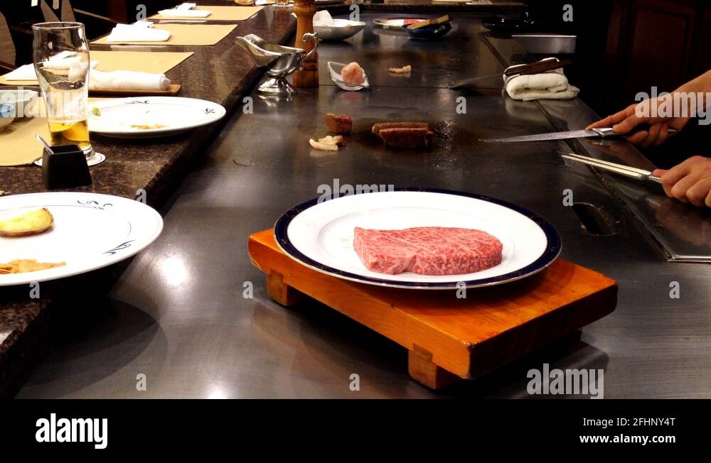 Teppanyaki Chef Restaurant Cutting and Serving Teppanyaki Style Wagyu ...