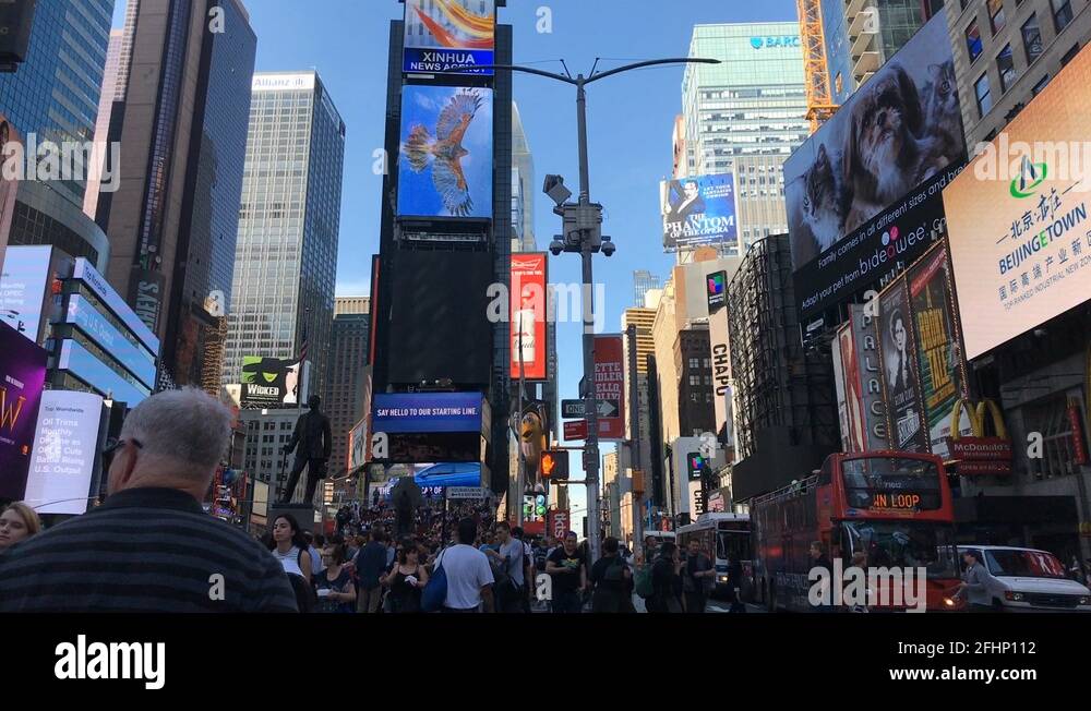 People Walking On the Very Busy Intersection In Times Square New York ...