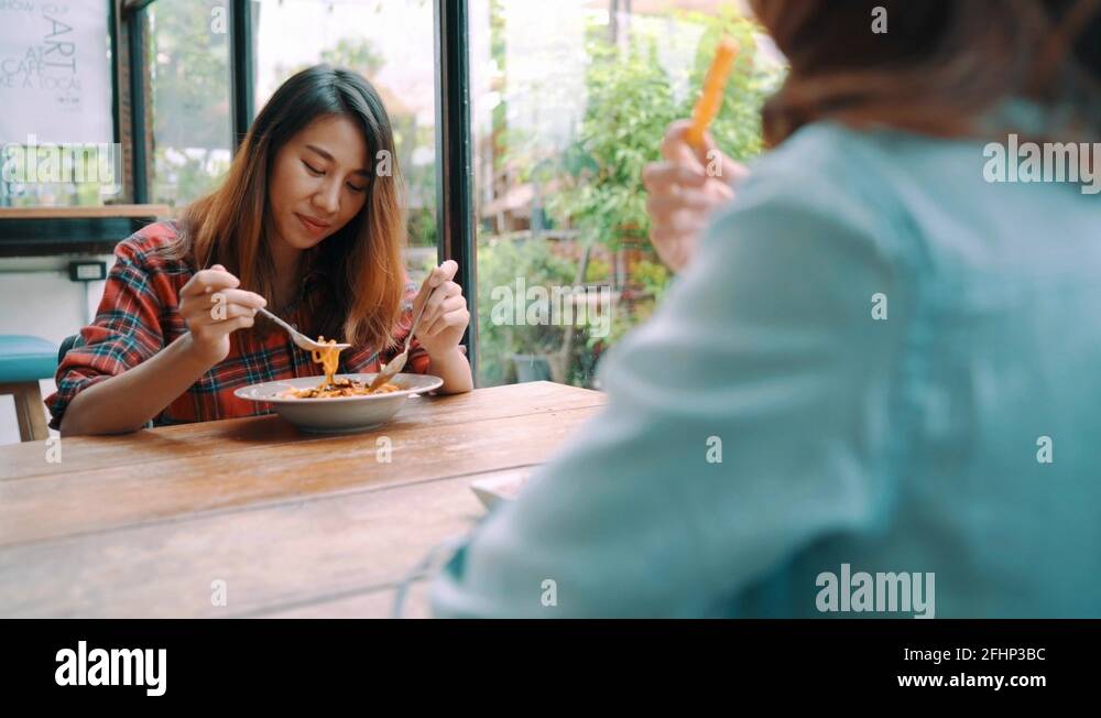 Beautiful happy Asian women lesbian lgbt couple sitting each side ...