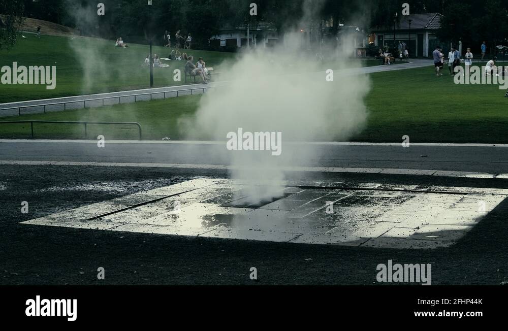 Steam Rising Up out of a City Street Drainage Grate Stock Video Footage ...