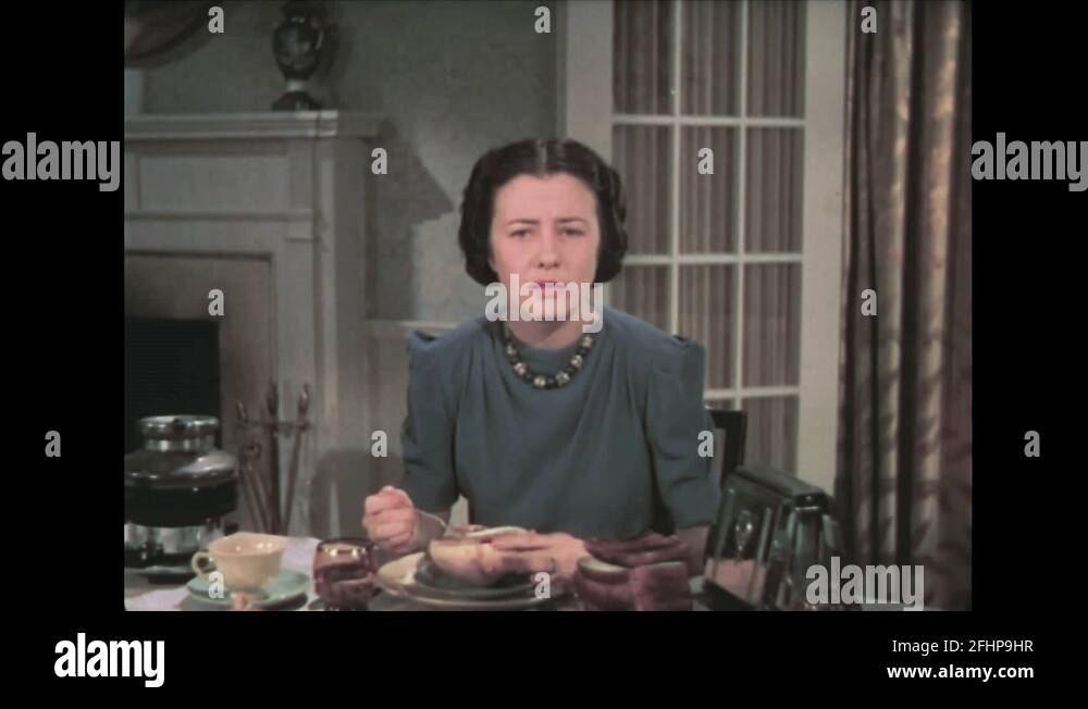 1930s: Mother stares across table. Daughter speaks. Mother responds ...