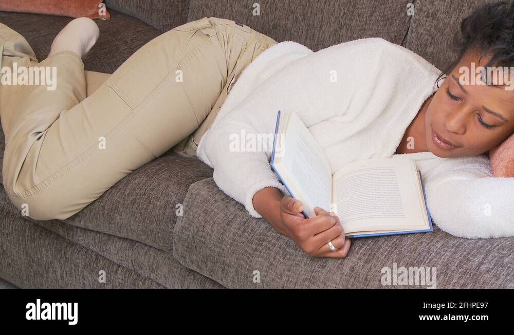 Woman laying sofa Stock Videos & Footage - HD and 4K Video Clips - Alamy