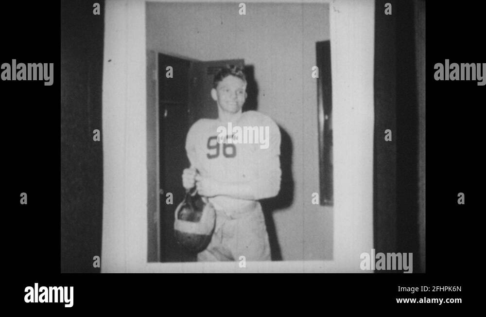 1950s: UNITED STATES: photo of football team captain. Ladies look at ...