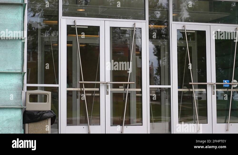 College filler shot - an attractive student leaves a modern university ...