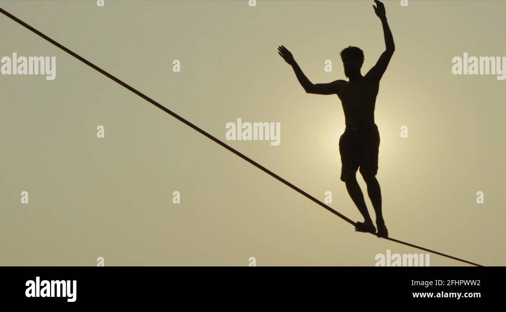 Walking a balance beam or slack line Stock Videos & Footage - HD and 4K ...