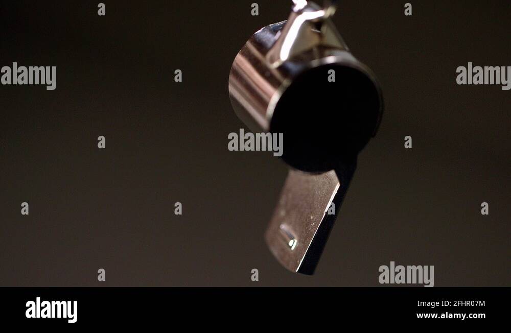 Single Whistle dangling from a string Stock Video Footage - Alamy