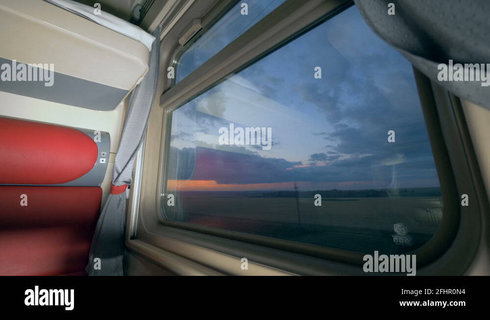Travelling by train concept. Evening scenery seen through the train's ...