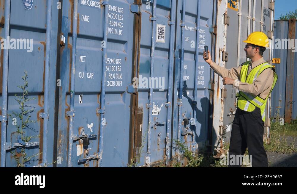 Worker Scanning a QR Code on a Shipping Container Box Stock Video ...