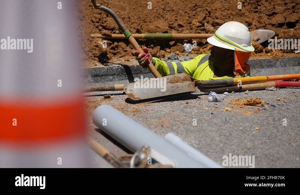 Worker digging hole Stock Videos & Footage - HD and 4K Video Clips - Alamy