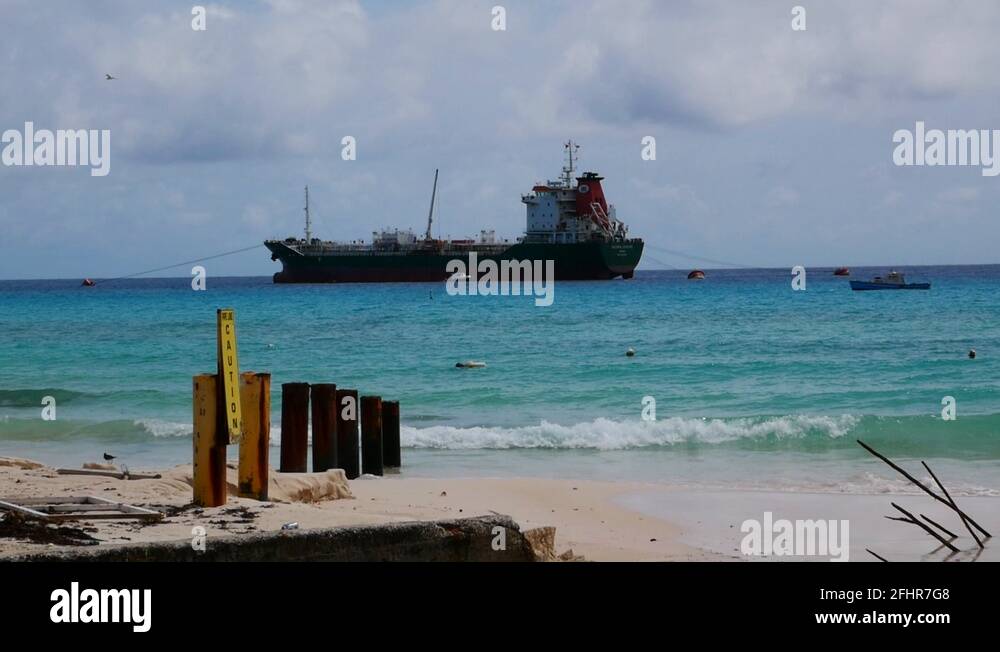 Cargo ship Anchored of the beach in Barbados Stock Video Footage - Alamy