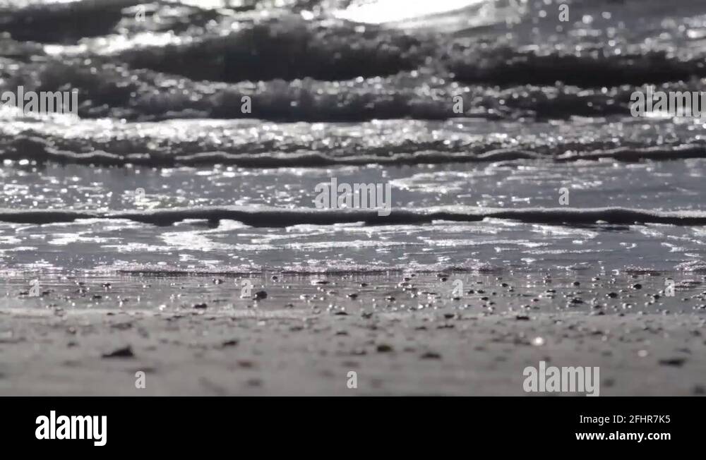 Water washing up on beach Stock Videos & Footage - HD and 4K Video ...