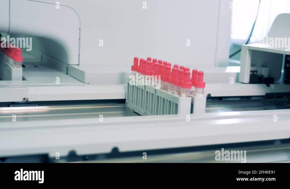 Test tubes are getting moved through the parts of the scanning machine ...