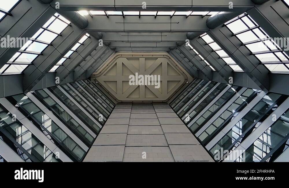 Looking up at the architectural design of a modern building. PAN DOWN ...