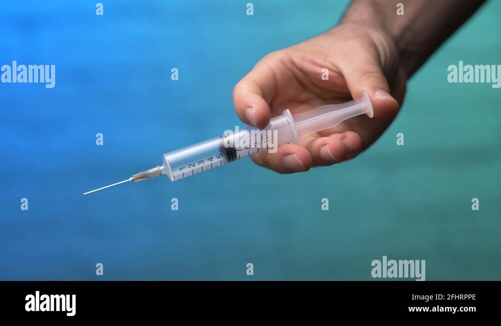 Holding a syringe Needle In Hand Showing it to The Camera Stock Video ...