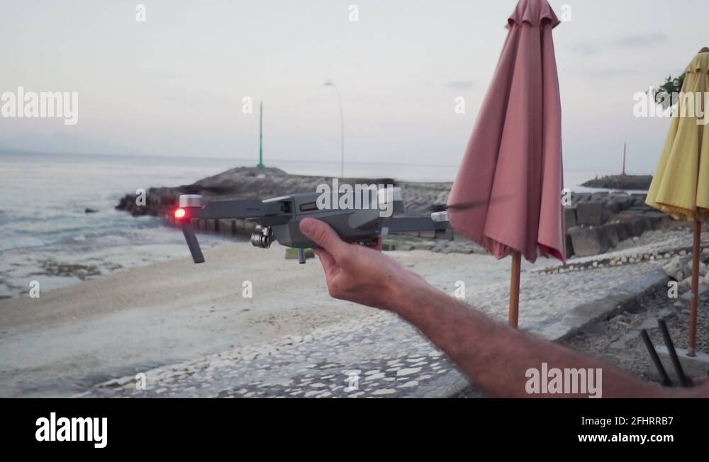 DJi Mavic Pro drone Taking off over water at the beach in bali ...
