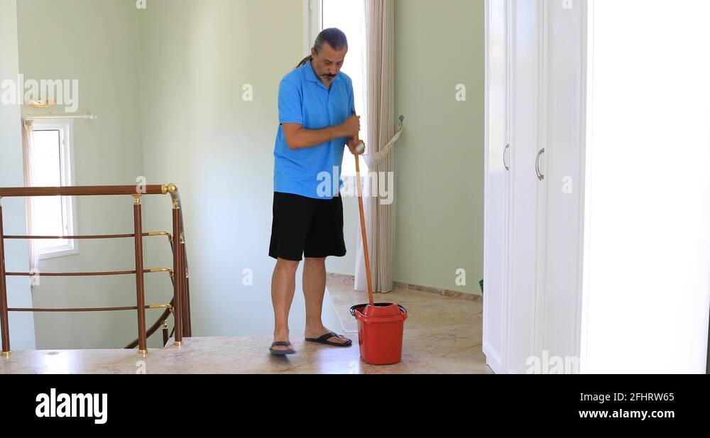 Happy man sweeping floor Stock Videos & Footage - HD and 4K Video Clips ...