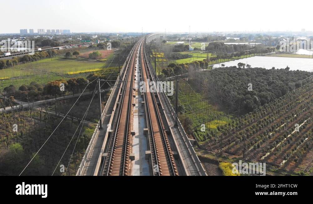 Raised high speed rail train passes. China's bullet train CSR zooming through Stock Video ...
