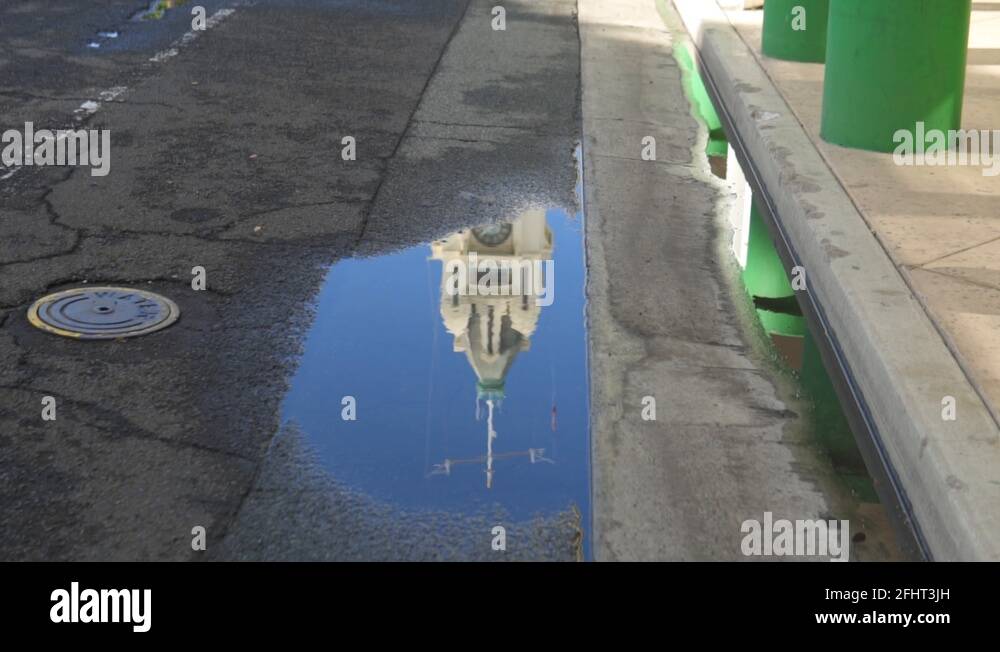 1080p Footage of Reflection of Aloha Tower in a Puddle Stock Video ...