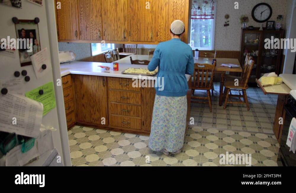 A Mennonite woman cooking in her farmhouse kitchen Stock Video Footage ...