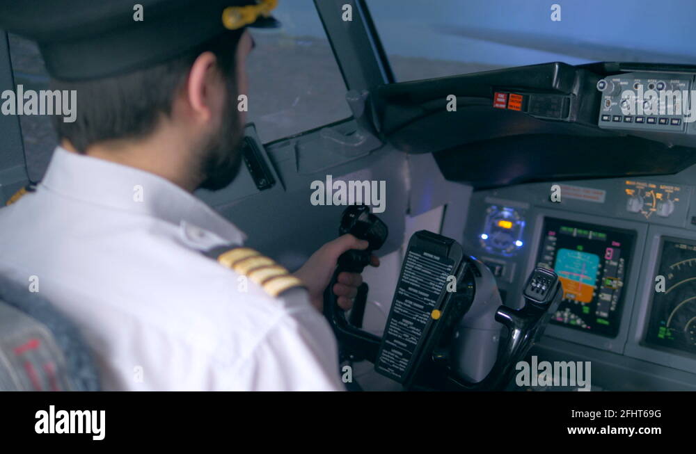 Back view of a male pilot managing an aircraft Stock Video Footage - Alamy