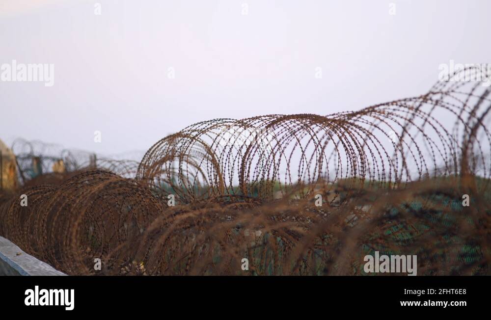 Barbed razor wire security fence Stock Videos & Footage - HD and 4K ...