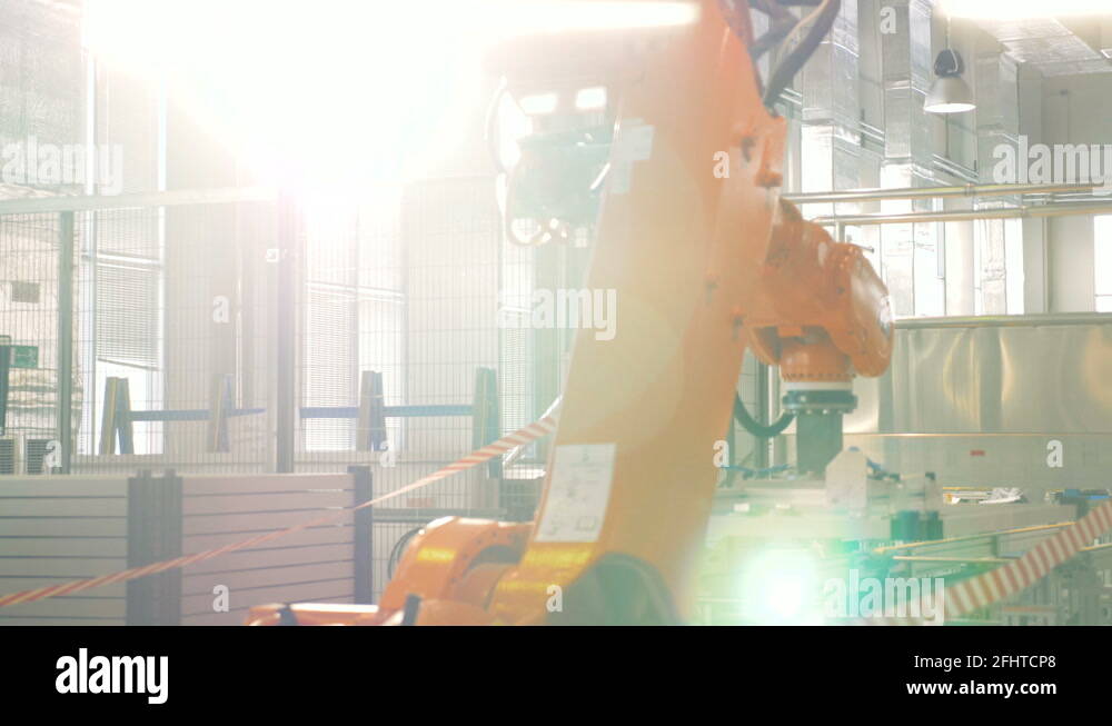 Automated modern industrial Robotic Arm works at factory facility Stock ...