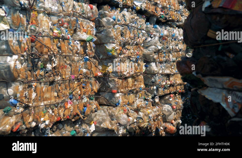 Packs of plastic junk contained in the outdoors waste deposit. Recycle ...