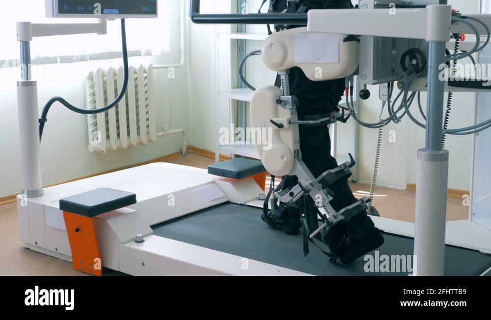 Prosthetic machine helps a man to walk, close up. Rehabilitation ...