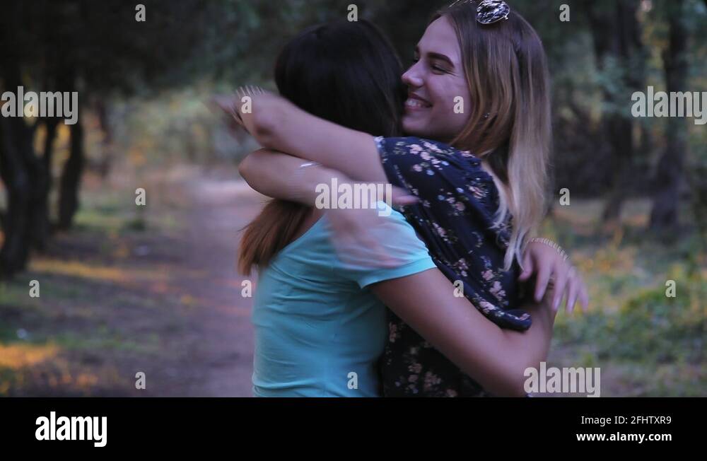 2 girls hugging Stock Videos & Footage - HD and 4K Video Clips - Alamy