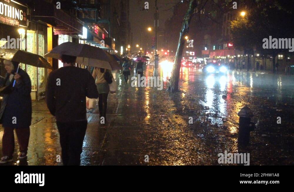 Massive puddle floods a busy city intersection as workers and people ...